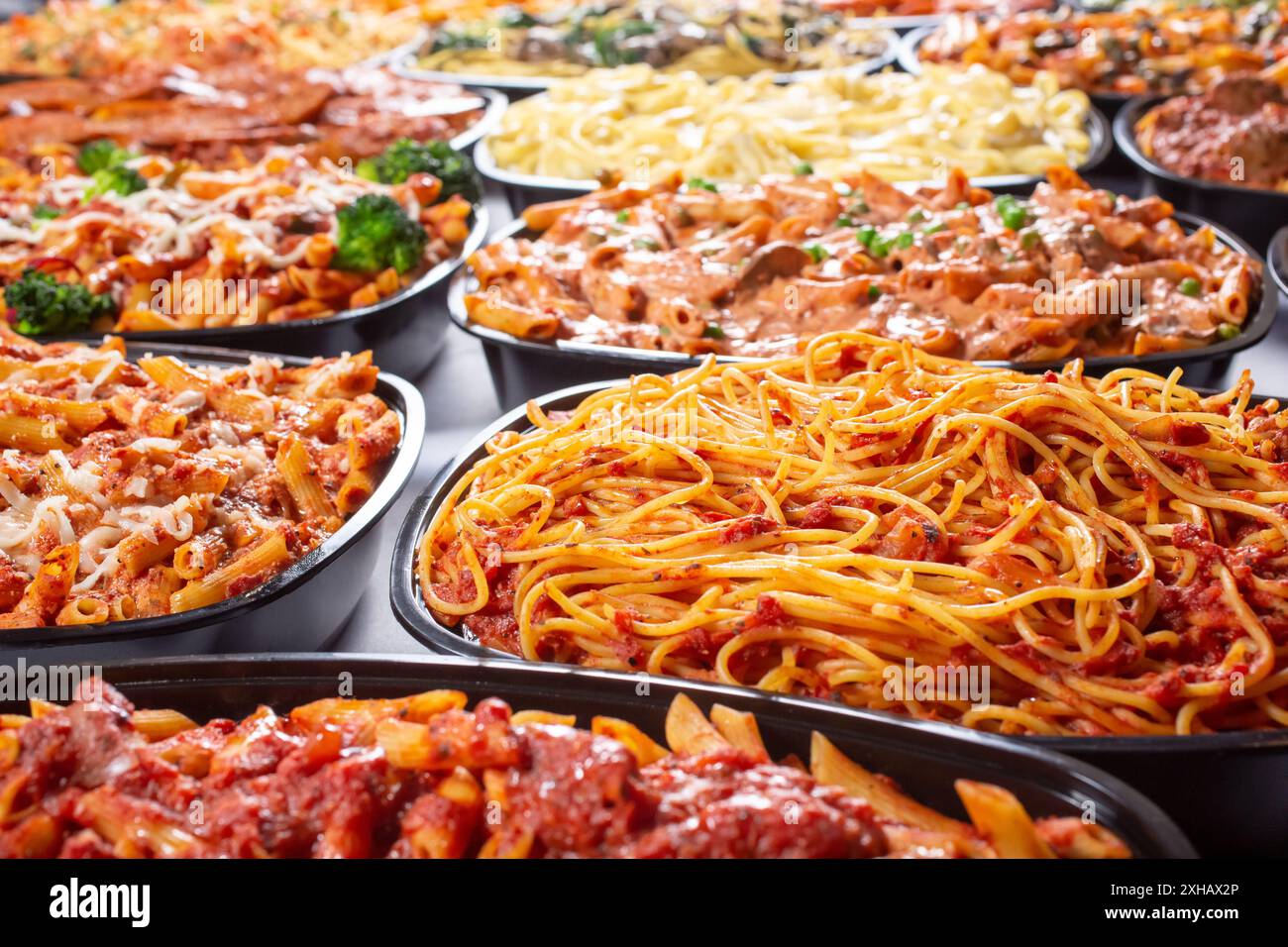 A view of several varieties of pasta trays, featuring a tray of ...