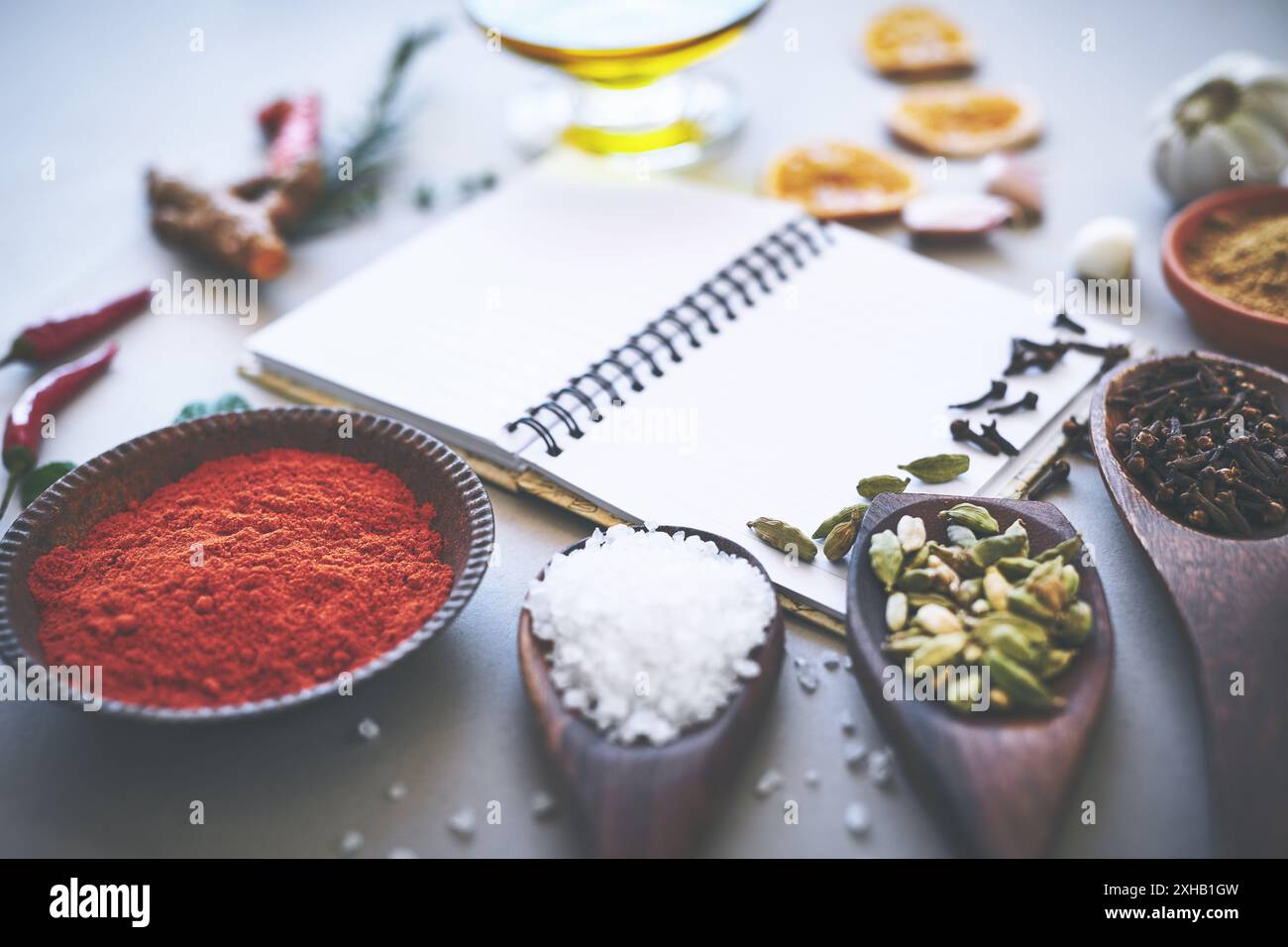 Herbs, spices and seasoning on table with notebook, inspiration and ...