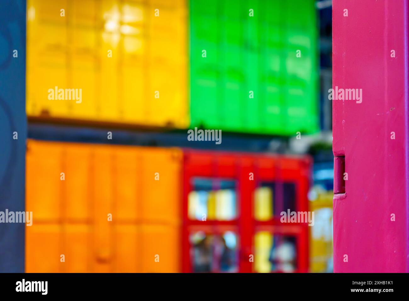 View of warehouse building with various colorful shipping containers ...