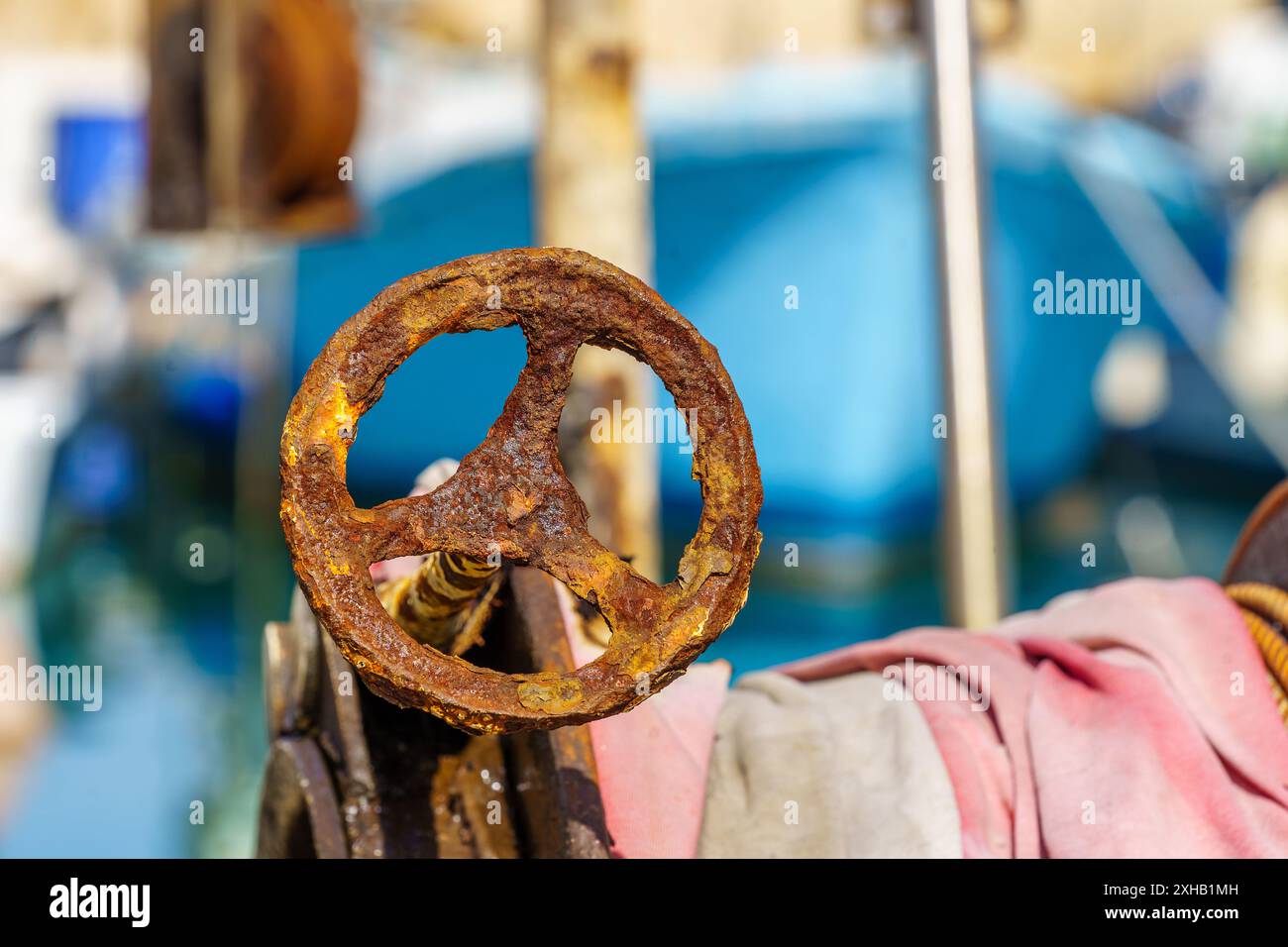 View of rusted gear and fishing boats in the historic port of Jaffa ...