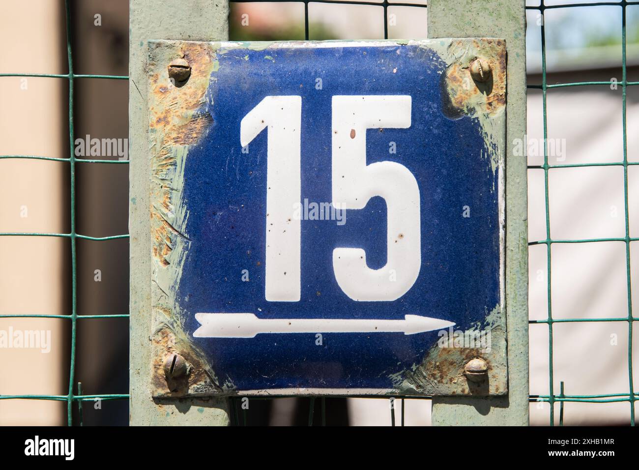 Weathered enameled plate of street address with number 15 Stock Photo ...