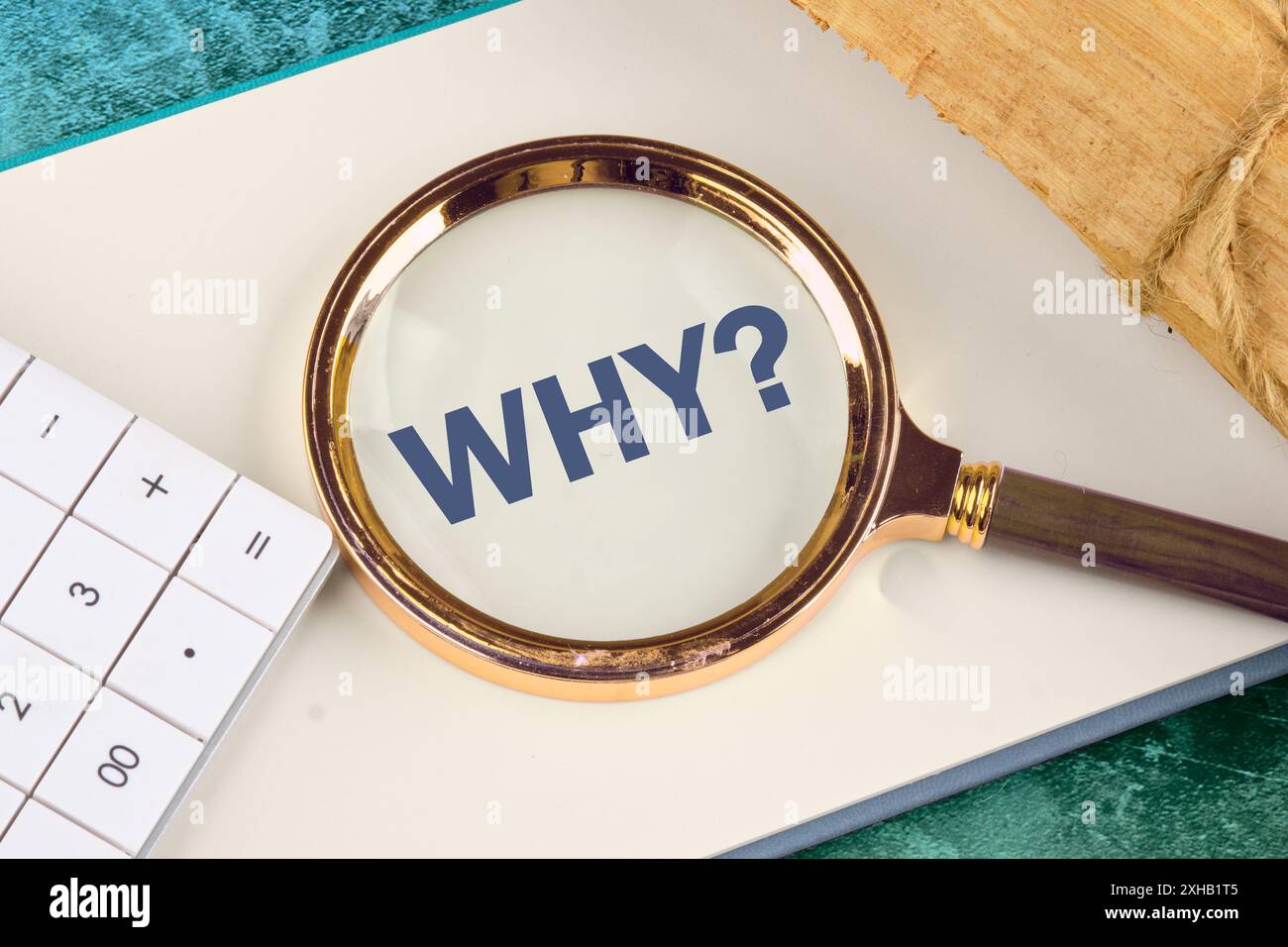 WHY word written appeared through a magnifying glass in a notebook ...