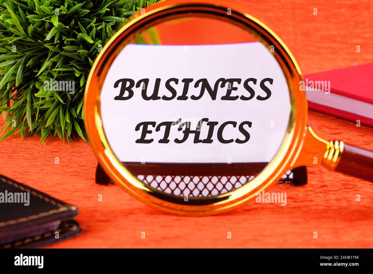 business terms concept. Business ethics, word text written through a ...