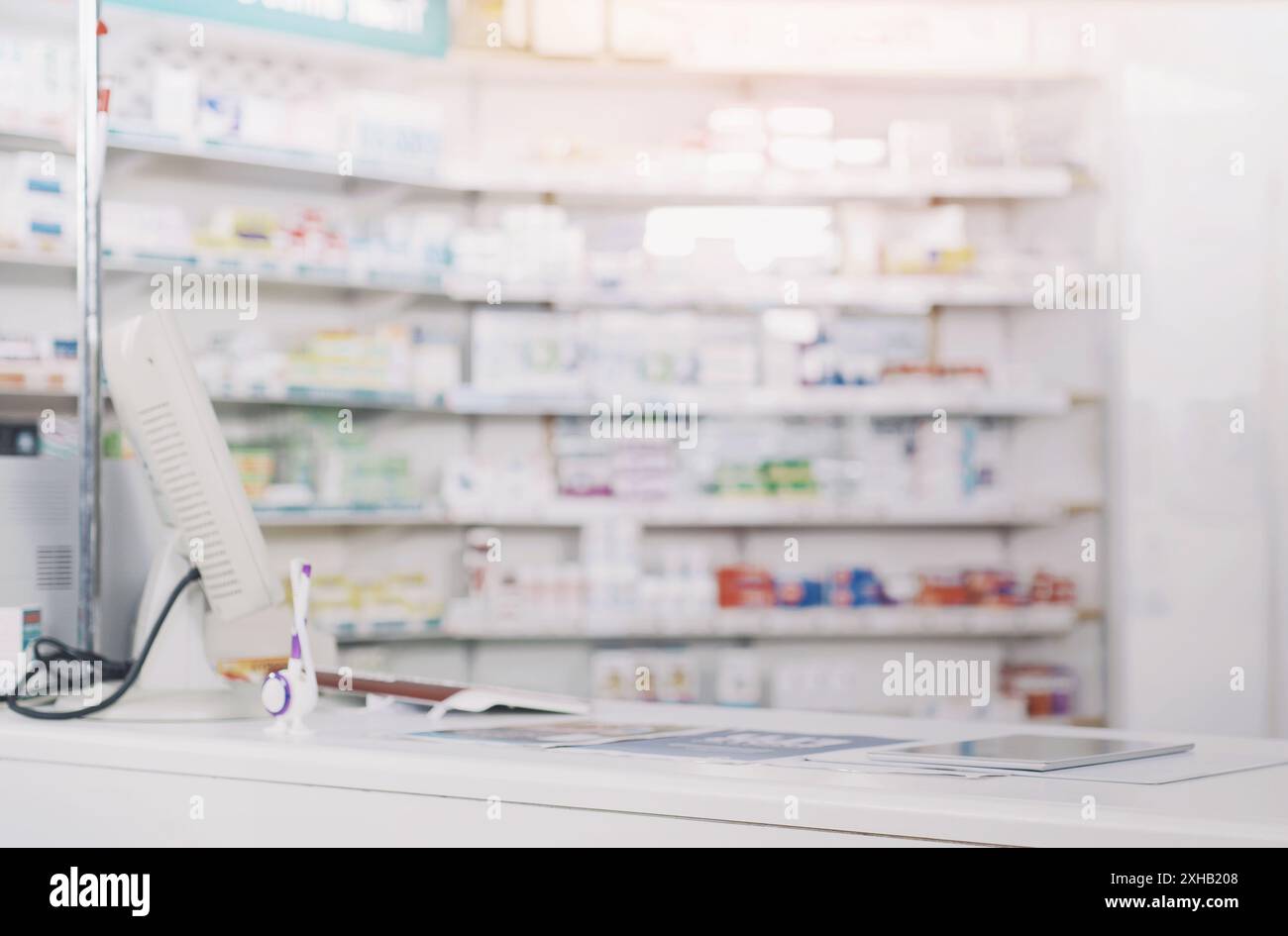 Medication, pharmacy and desk with shelves in dispensary for ...