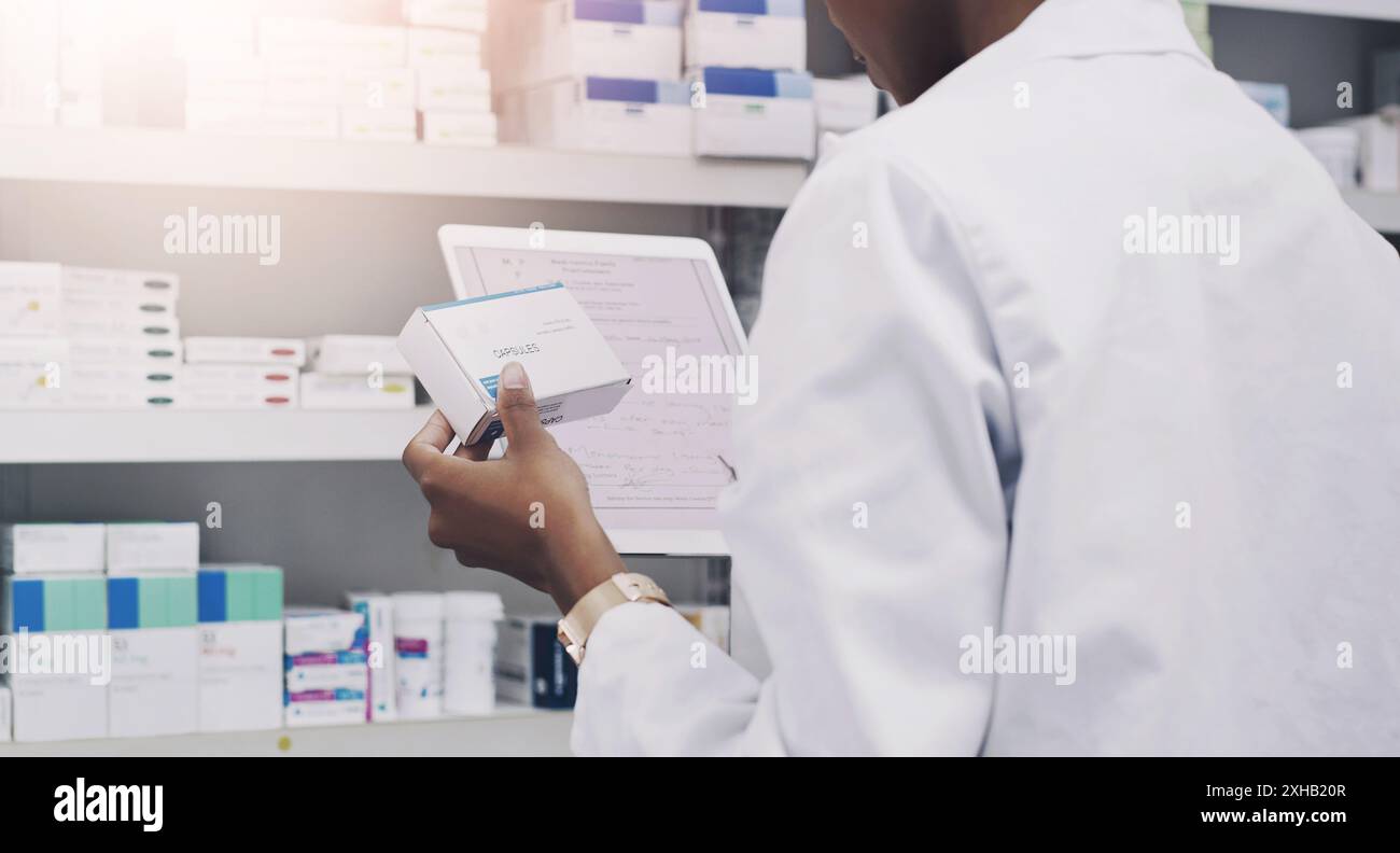 Pharmacist, hands and tablet with medicine for prescription, checking ...