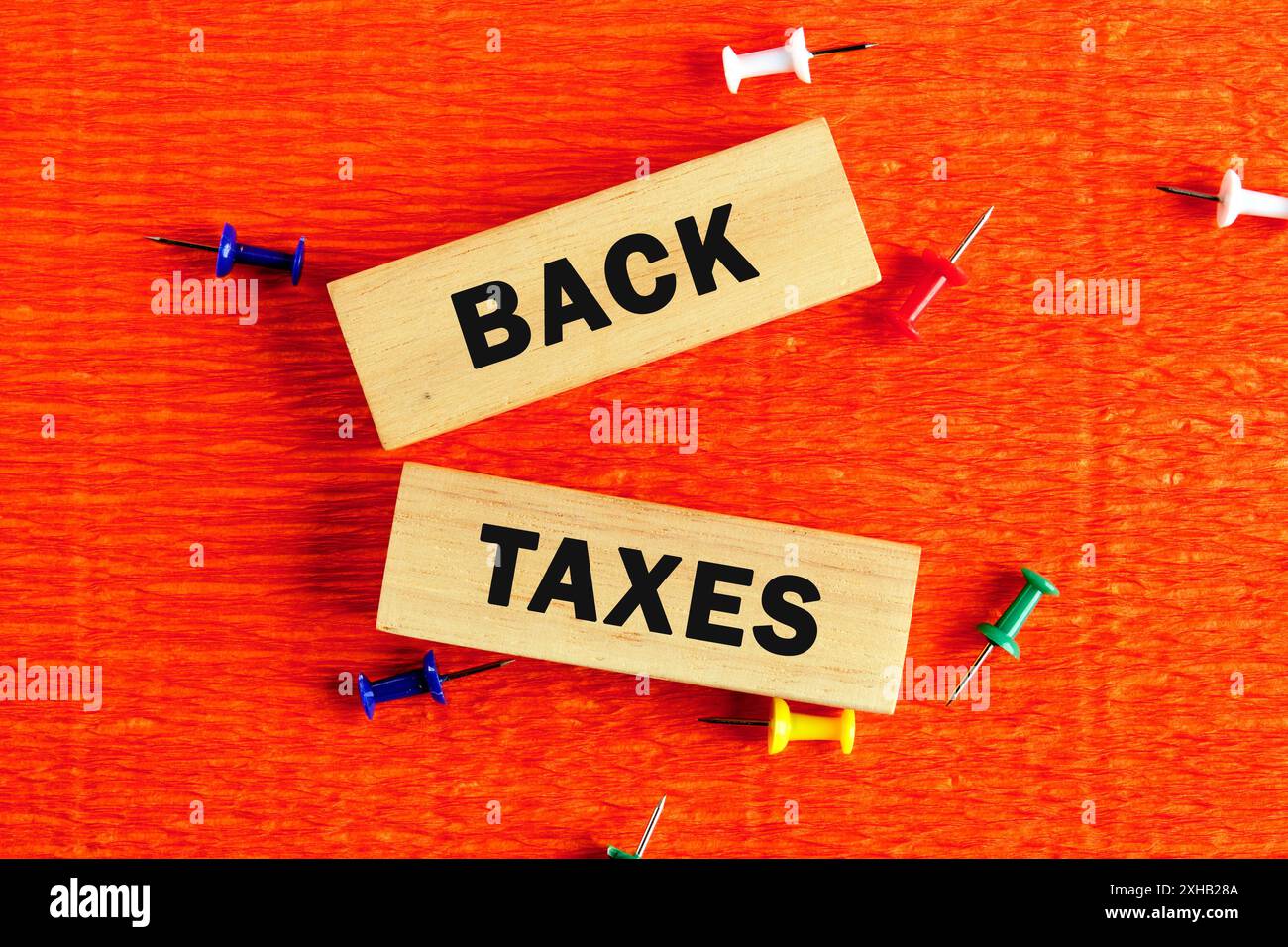Business and back taxes concept. BACK TAXES symbol on wooden blocks ...