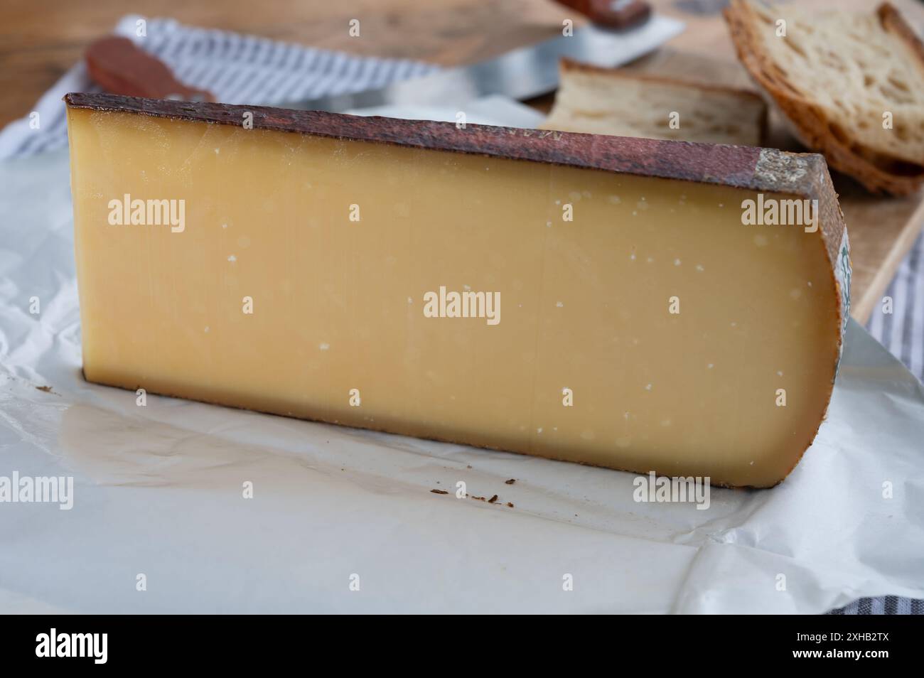 French aged in caves cheese Comte with brown rind, made from ...