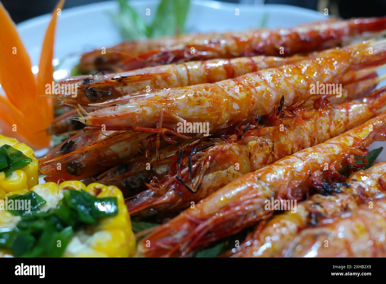 Grilled tiger prawns with sweet corn on the cob Stock Photo - Alamy
