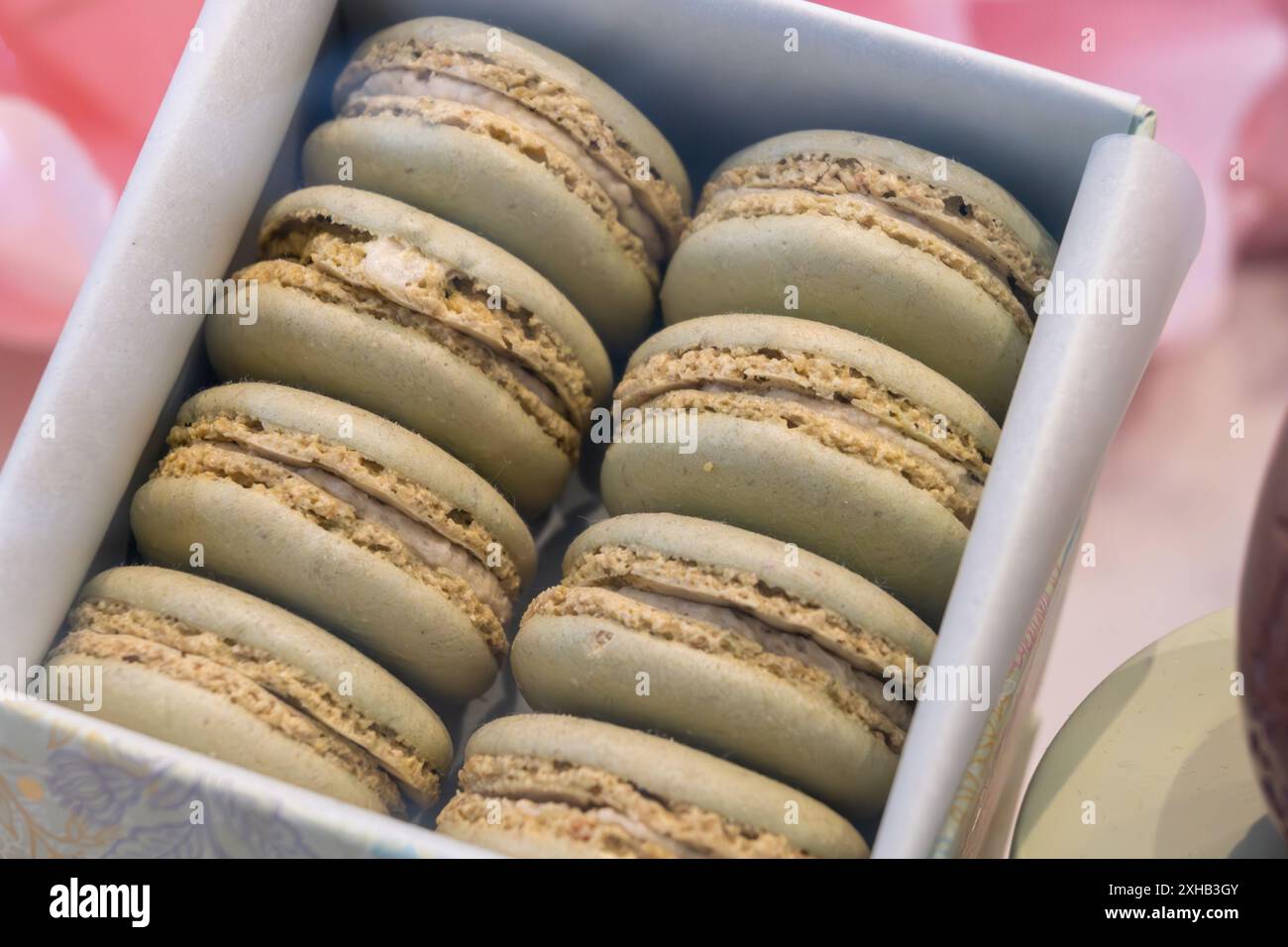 French macarons in box, sweet meringue-based confection made with egg ...