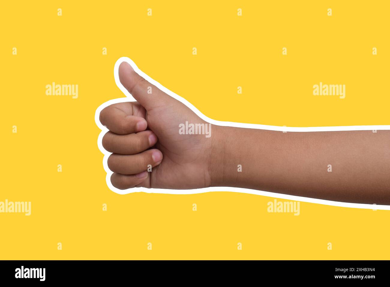 Children's hands showing thumbs up isolated on yellow background. Like ...
