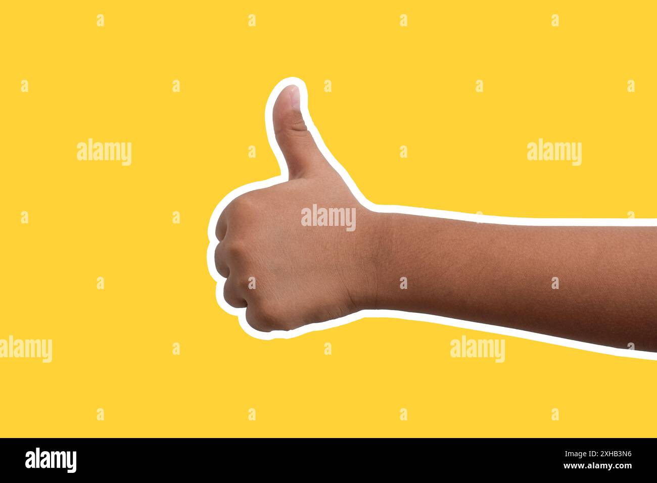 Children's hands showing thumbs up isolated on yellow background. Like ...