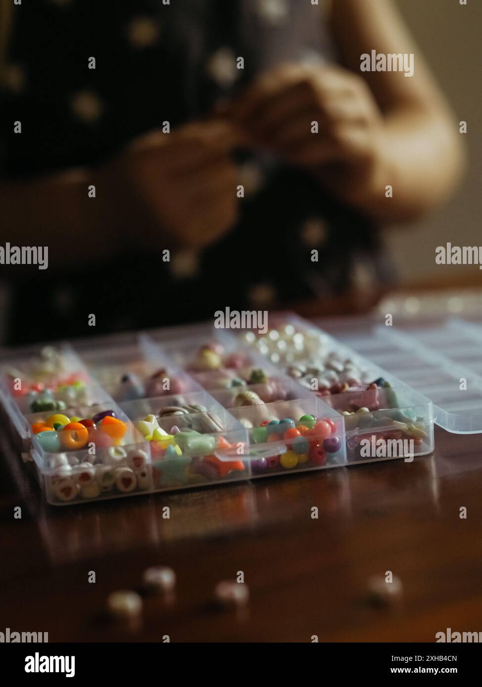 Kid Craft with Beads: A vertical close-up shot captures an open box of ...