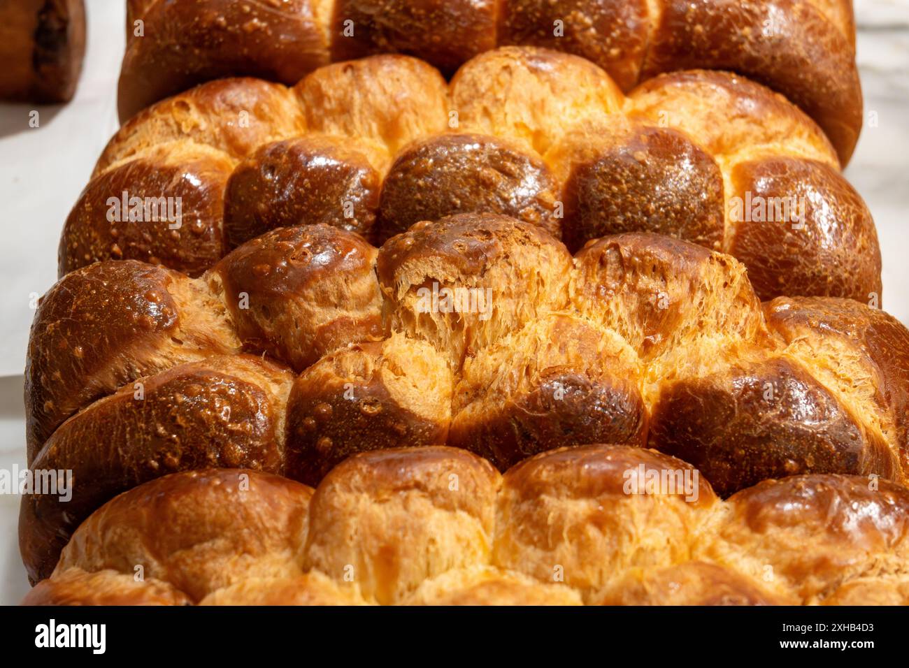 Traditional Jewish bread challah braided brioche bread in bakery close ...
