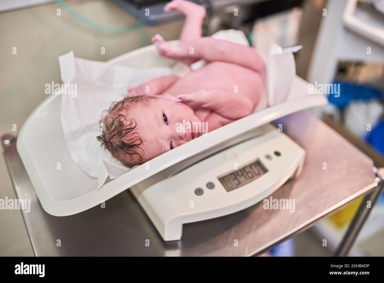 Newborn, kid and baby on scale for weight measurement or health in ...