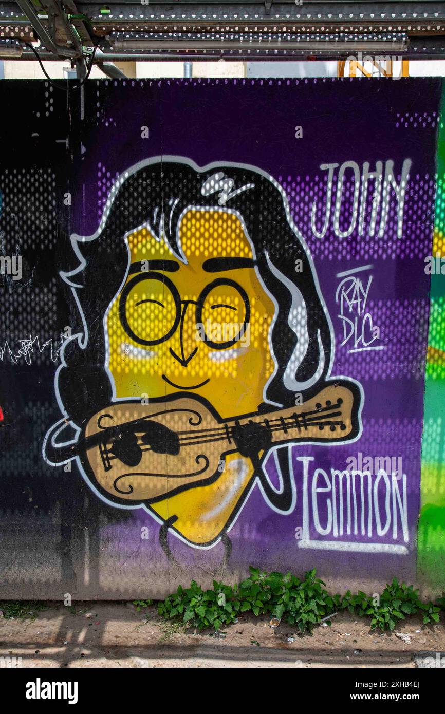 John Lemmon. Humorous graffiti on a construction site fence by artist ...