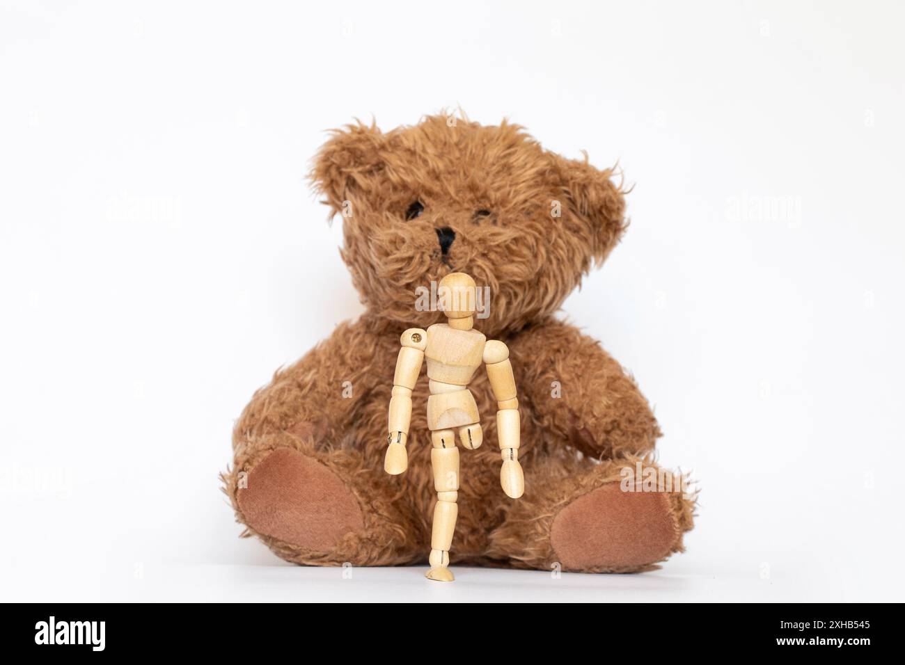 Wooden man without a leg and a bear on a white background, children's ...