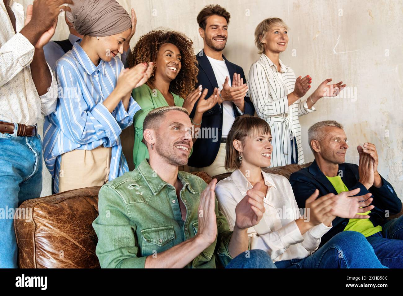 Enthusiastic diverse team clapping and cheering. Multicultural, multi ...
