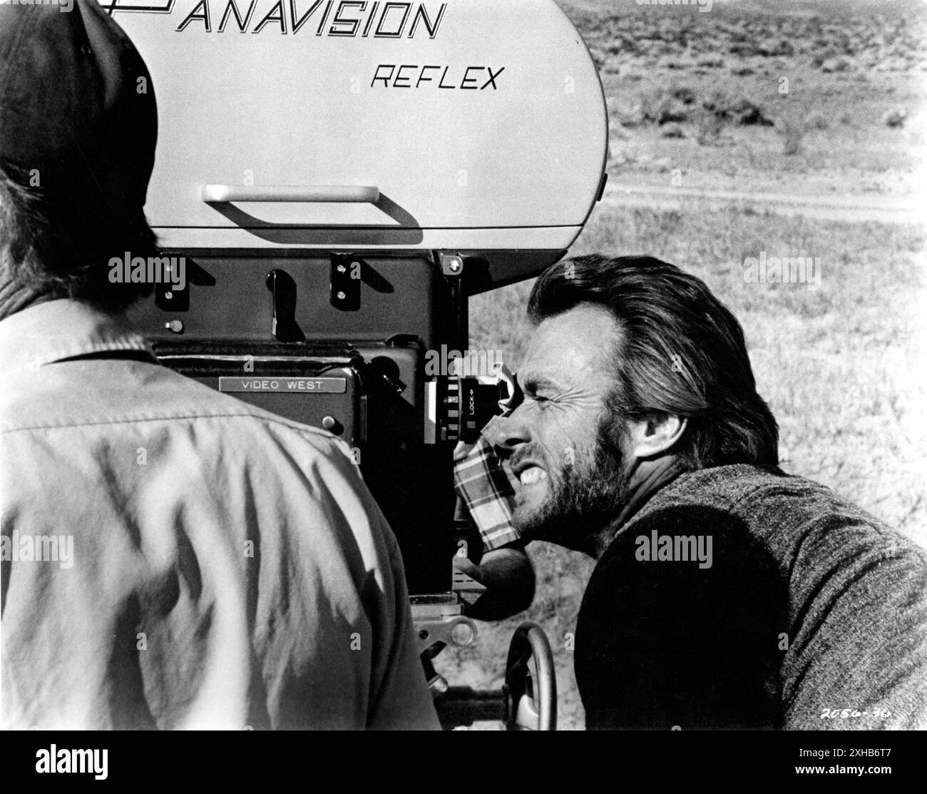 Star / Director CLINT EASTWOOD looks through viewfinder of Panavision ...