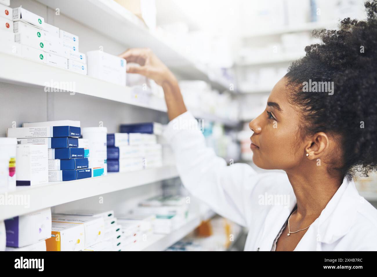 Black woman, healthcare and pharmacist with medicine in clinic of ...