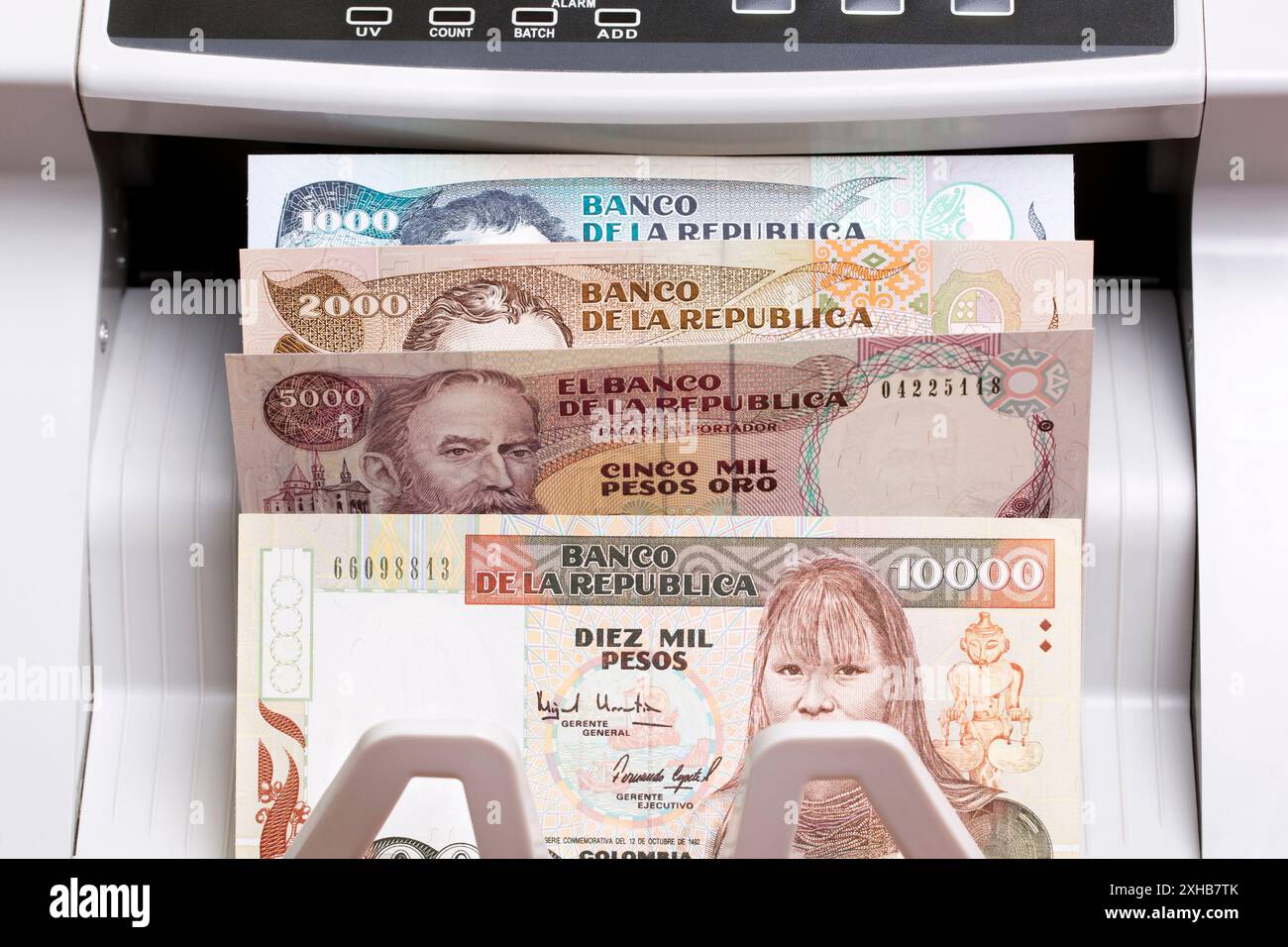 Colombian money - Pesos in the counting machine Stock Photo - Alamy