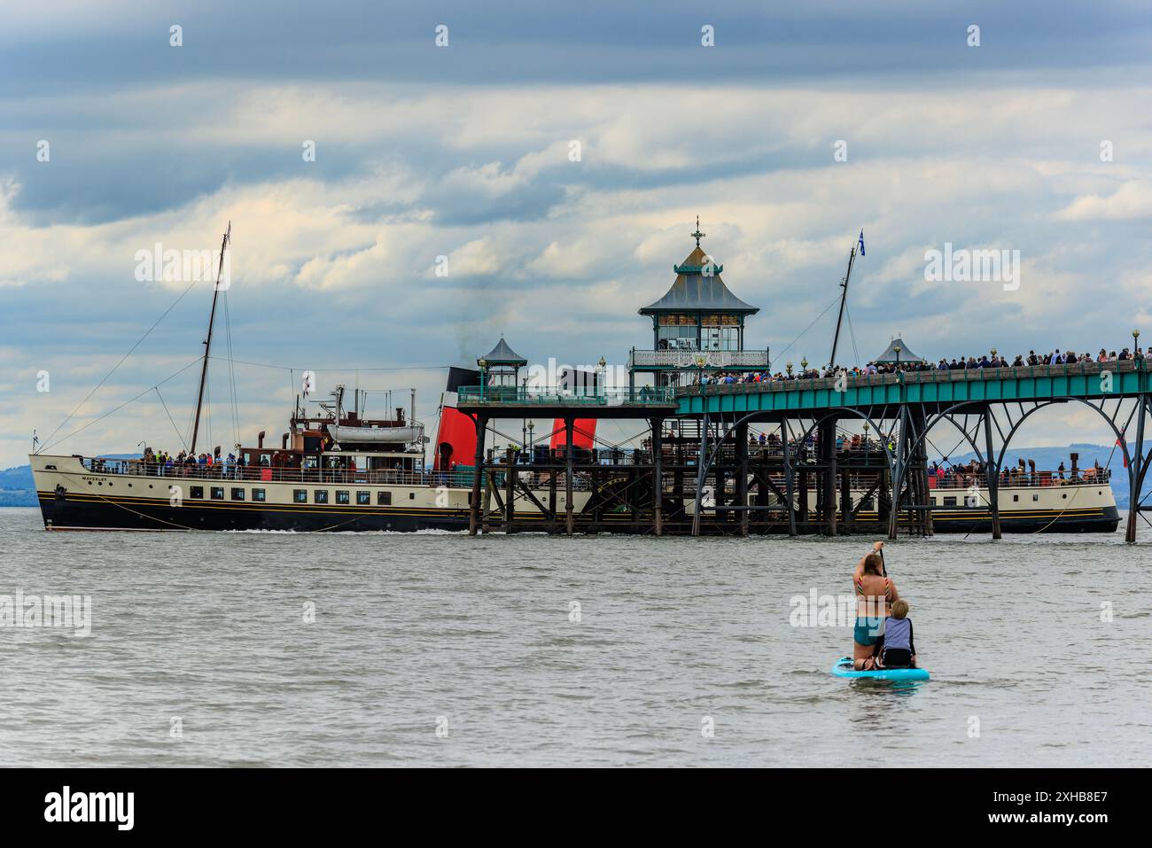 Paddle boarder and pier hi-res stock photography and images - Alamy