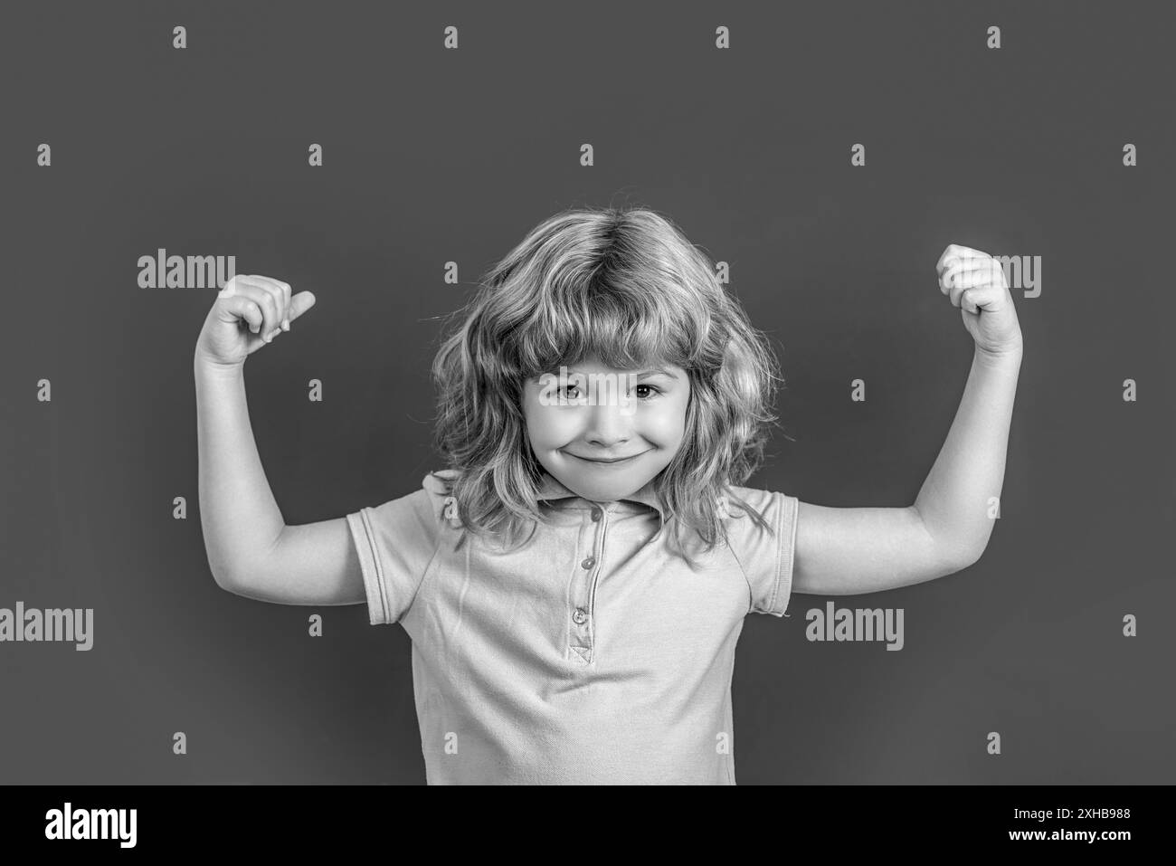 School boy isolated over green chalkboard background. Funny little ...
