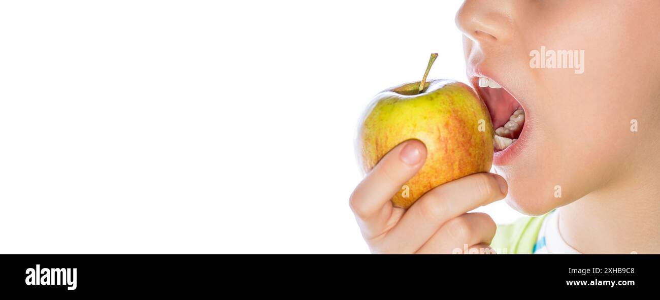 Little boy smiling happy eating green apple. Healthy food, good teeth ...