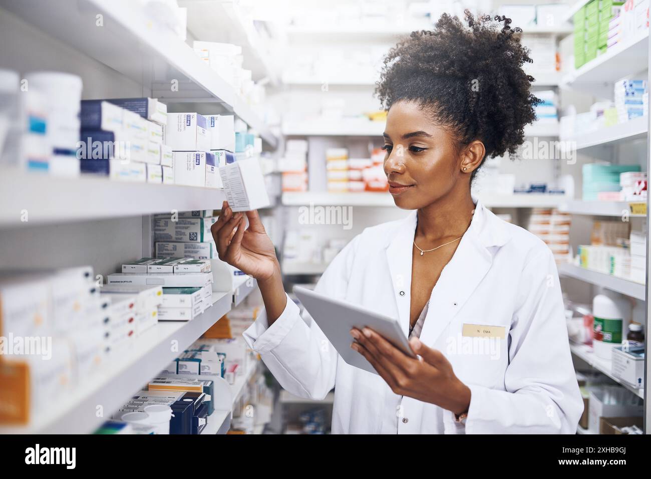Black woman, tablet and pharmacist check inventory for medicine, stock ...