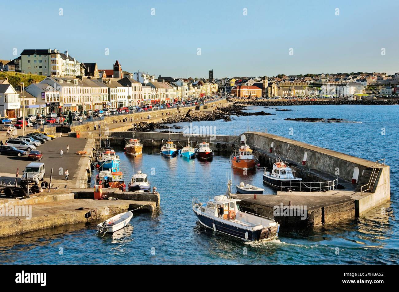 Portstewart fishing boat harbour and main street seafront, County Derry ...