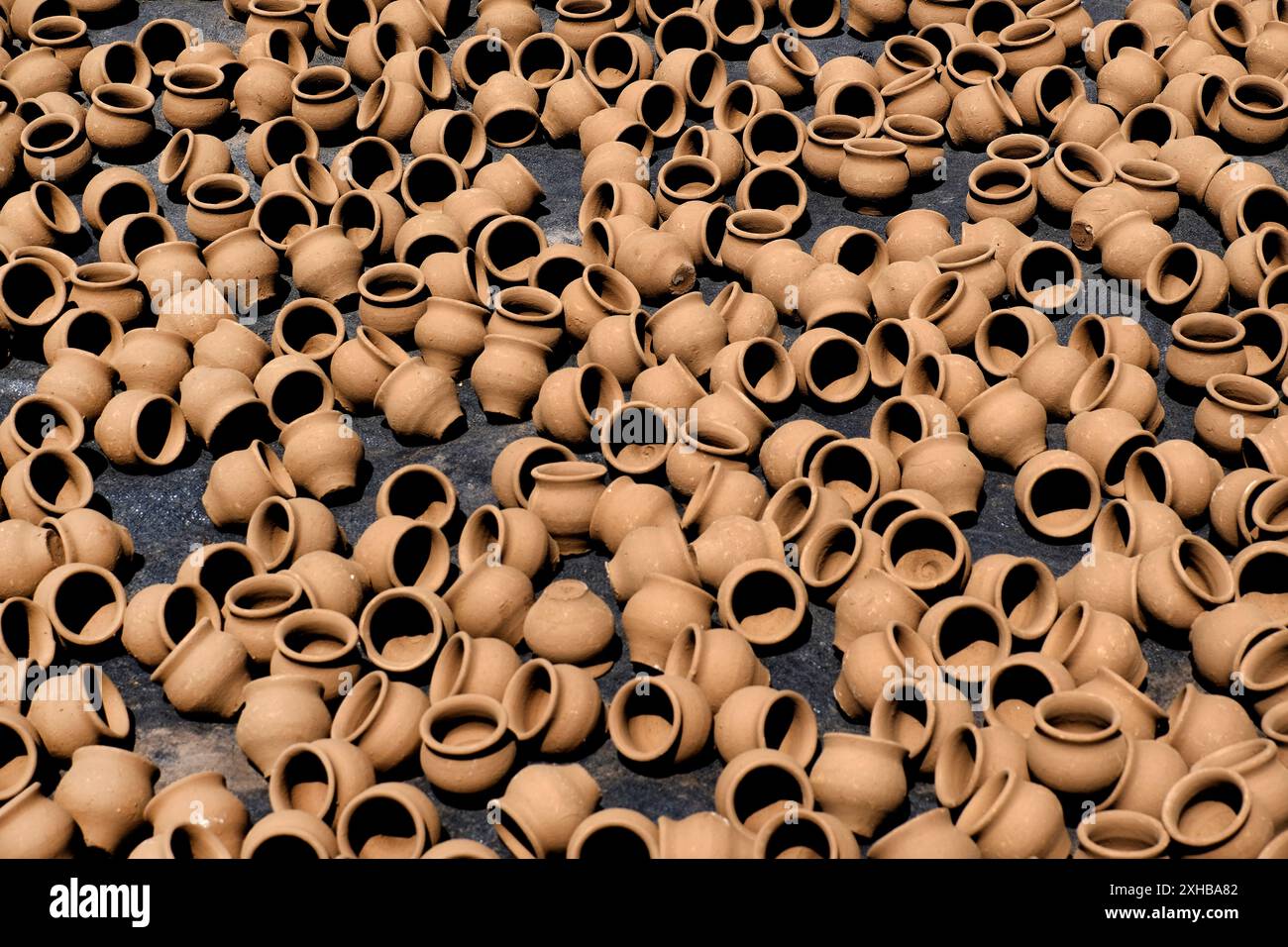 A potter crafts earthenware pottery on clay in Pune, India Stock Photo ...