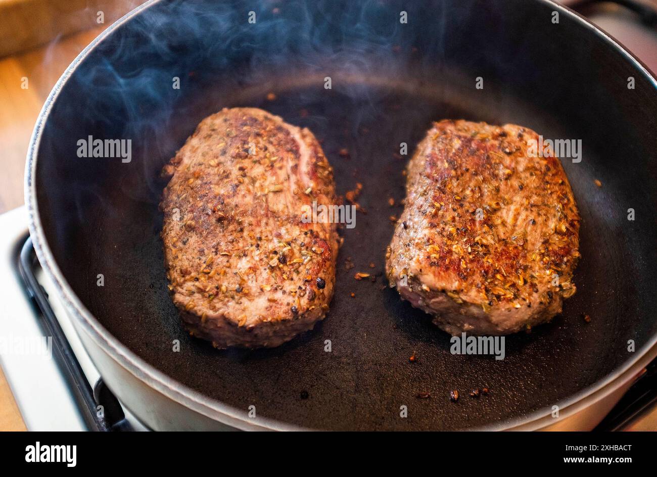 Frying beef steak in pan hi-res stock photography and images - Alamy