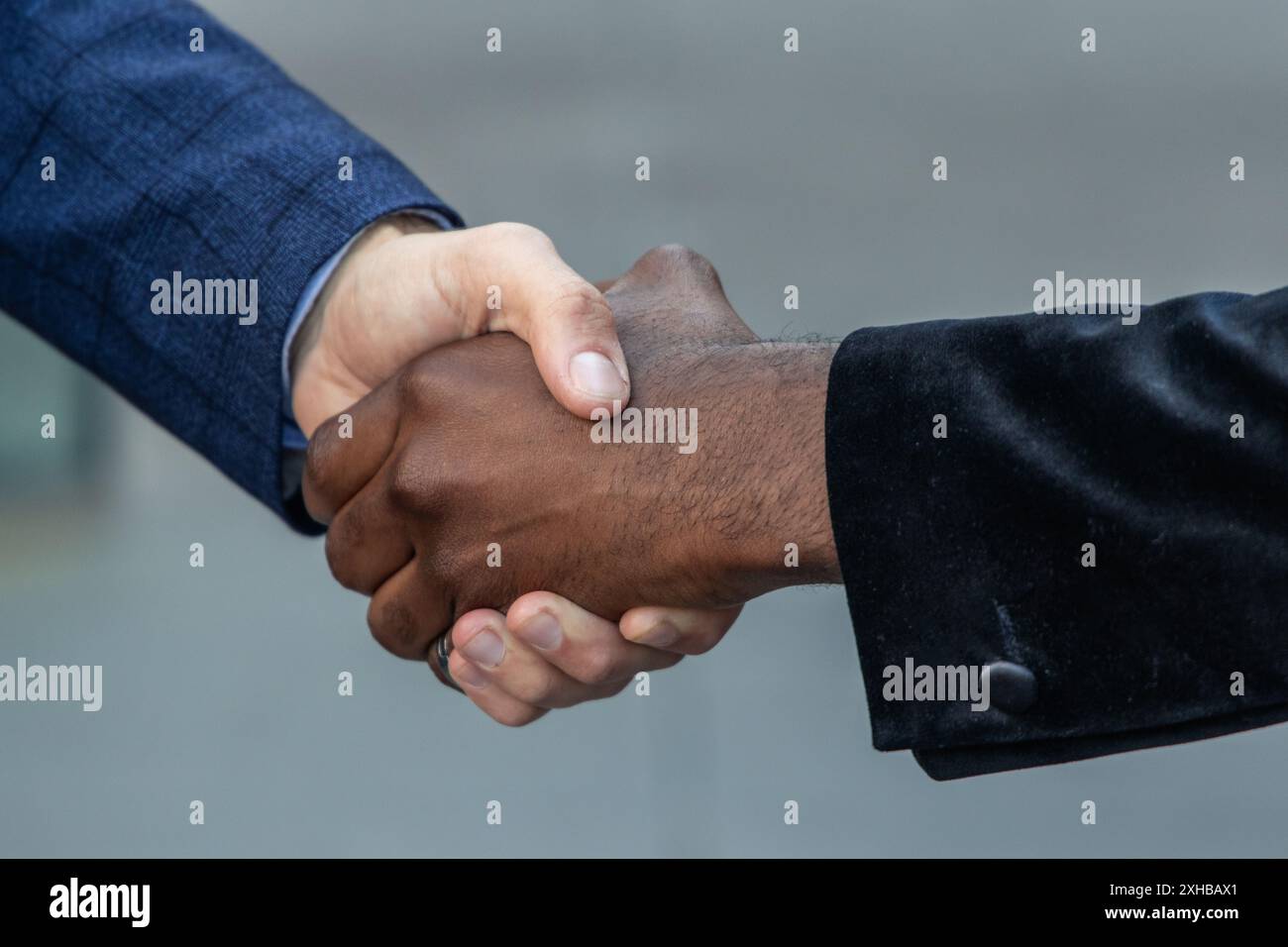 Closeup view of a handshake between an African American businessman and ...