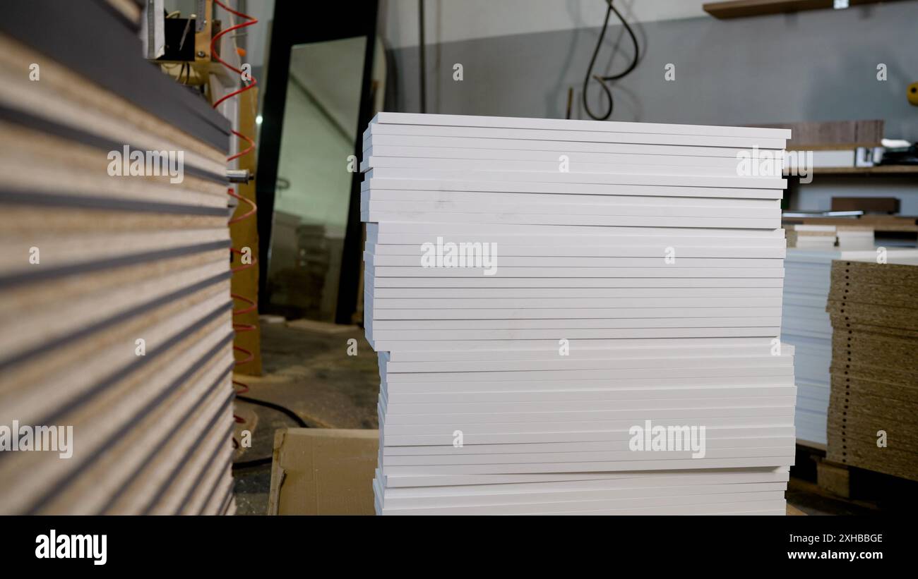 A stack of MDF panels close-up at a furniture production facility ...
