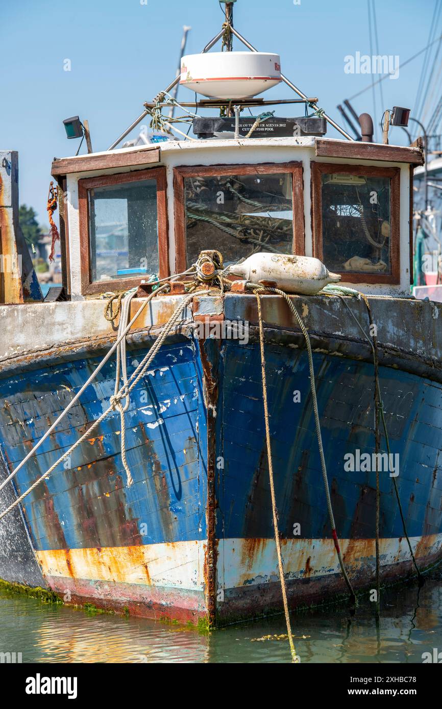 rusty old fishing trawler abandoned in a harbour Stock Photo - Alamy