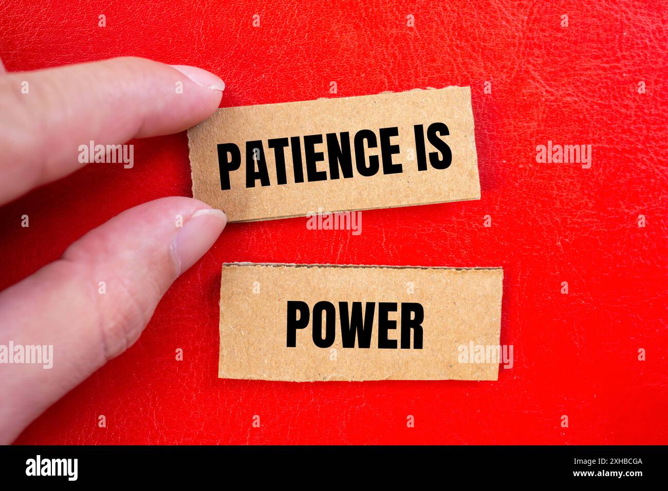 Patience is power message written on ripped cardboard paper pieces with ...
