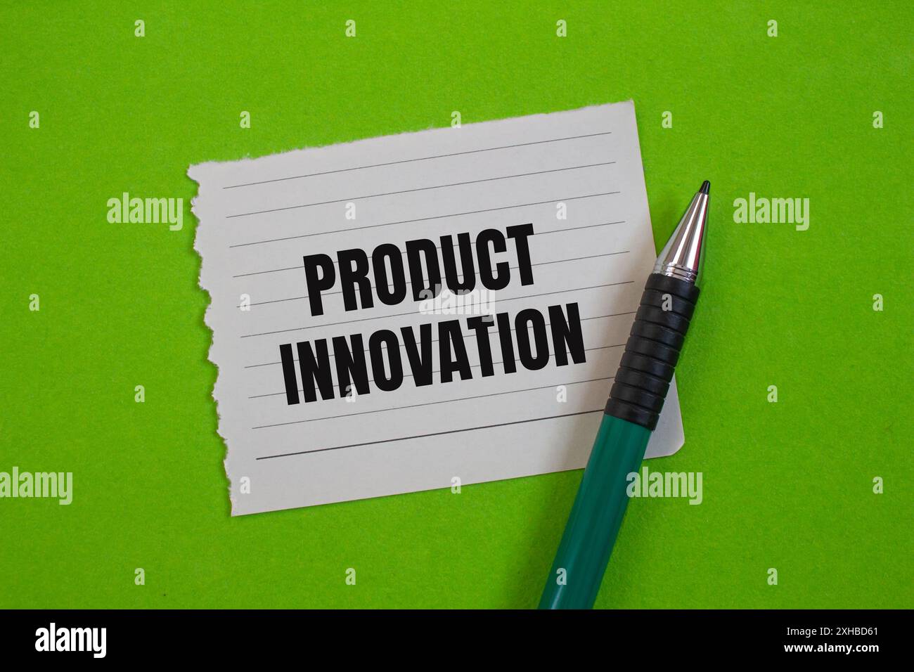 Product innovation message written on ripped paper piece with ...