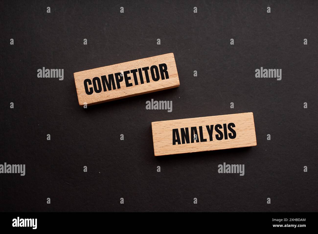 Competitor analysis message written on wooden blocks with black ...
