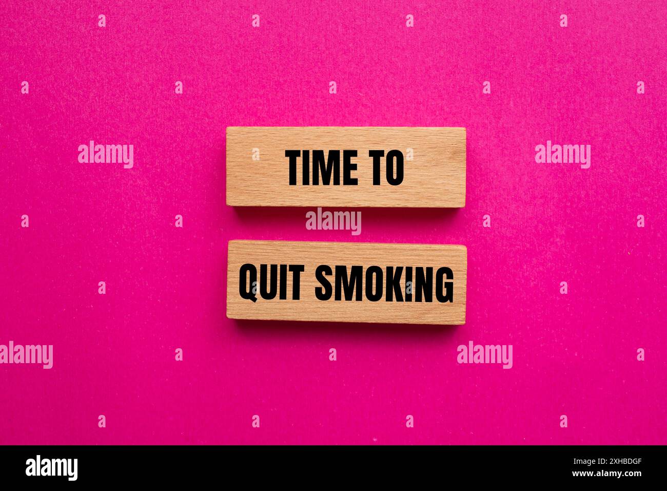 Time to quit smoking message written on wooden blcoks with pink ...