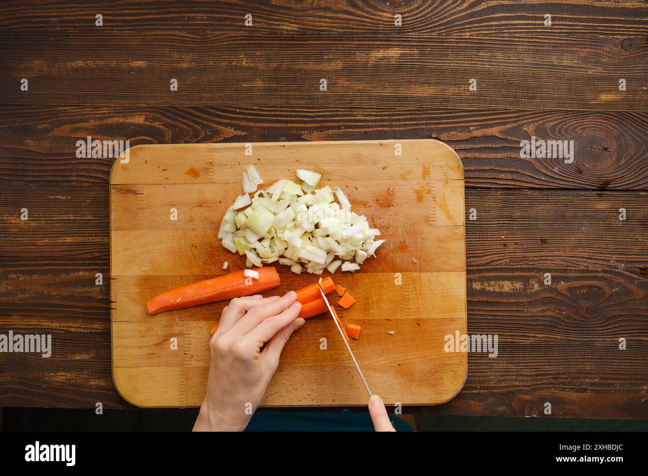 Woman cutting carrot knife on hi-res stock photography and images - Alamy