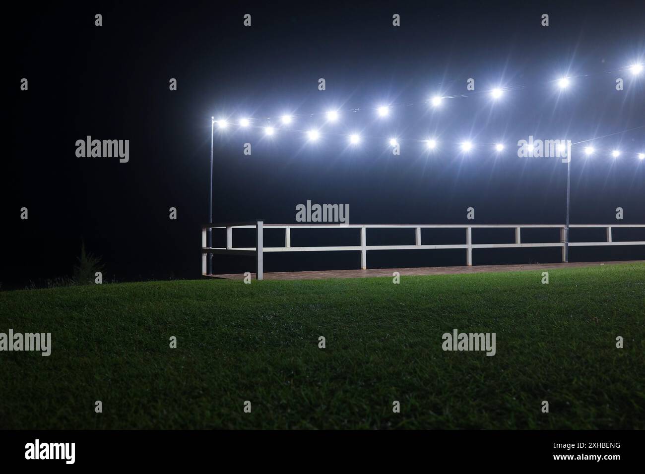 lawn, balustrade and electric lights at night Stock Photo - Alamy