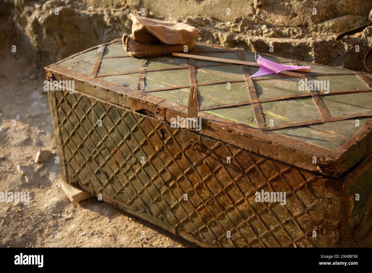 An ancient iron-bound wooden chest with a broken keyhole on a ...
