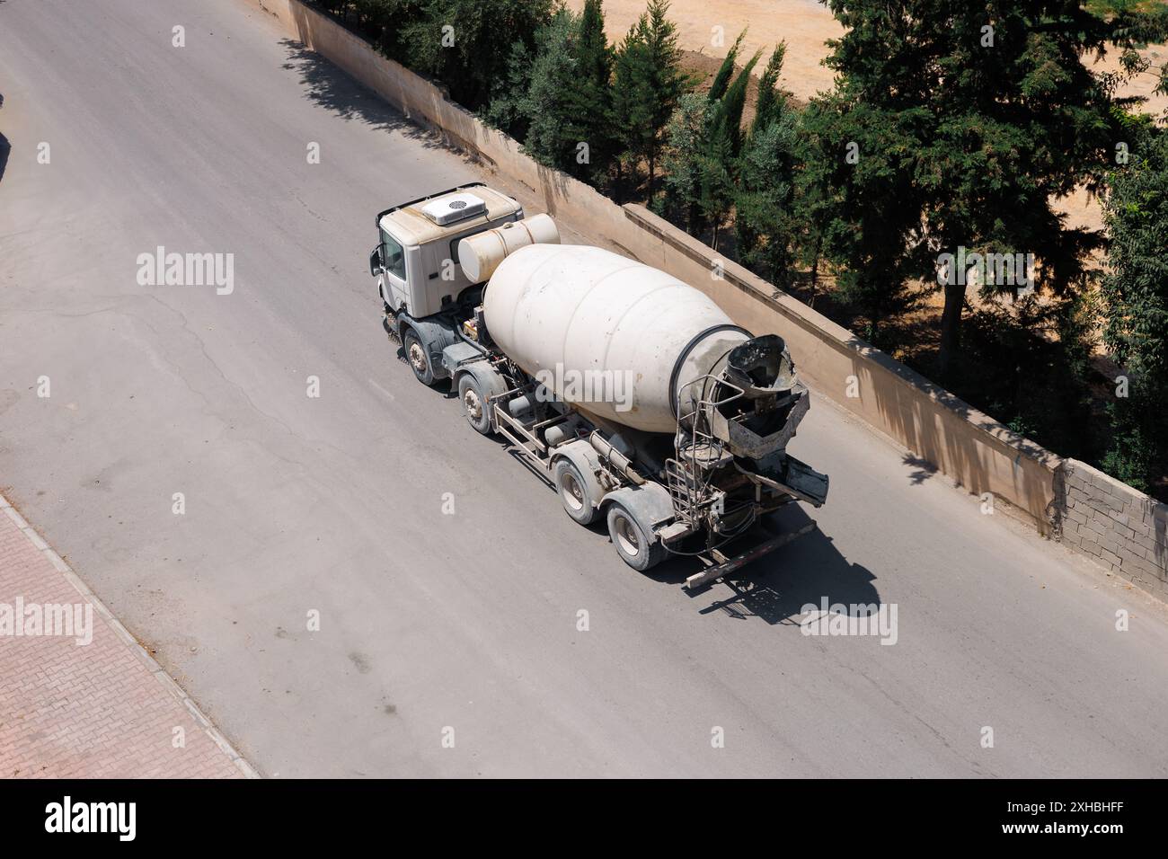 a concrete mixer goes on the road Stock Photo - Alamy