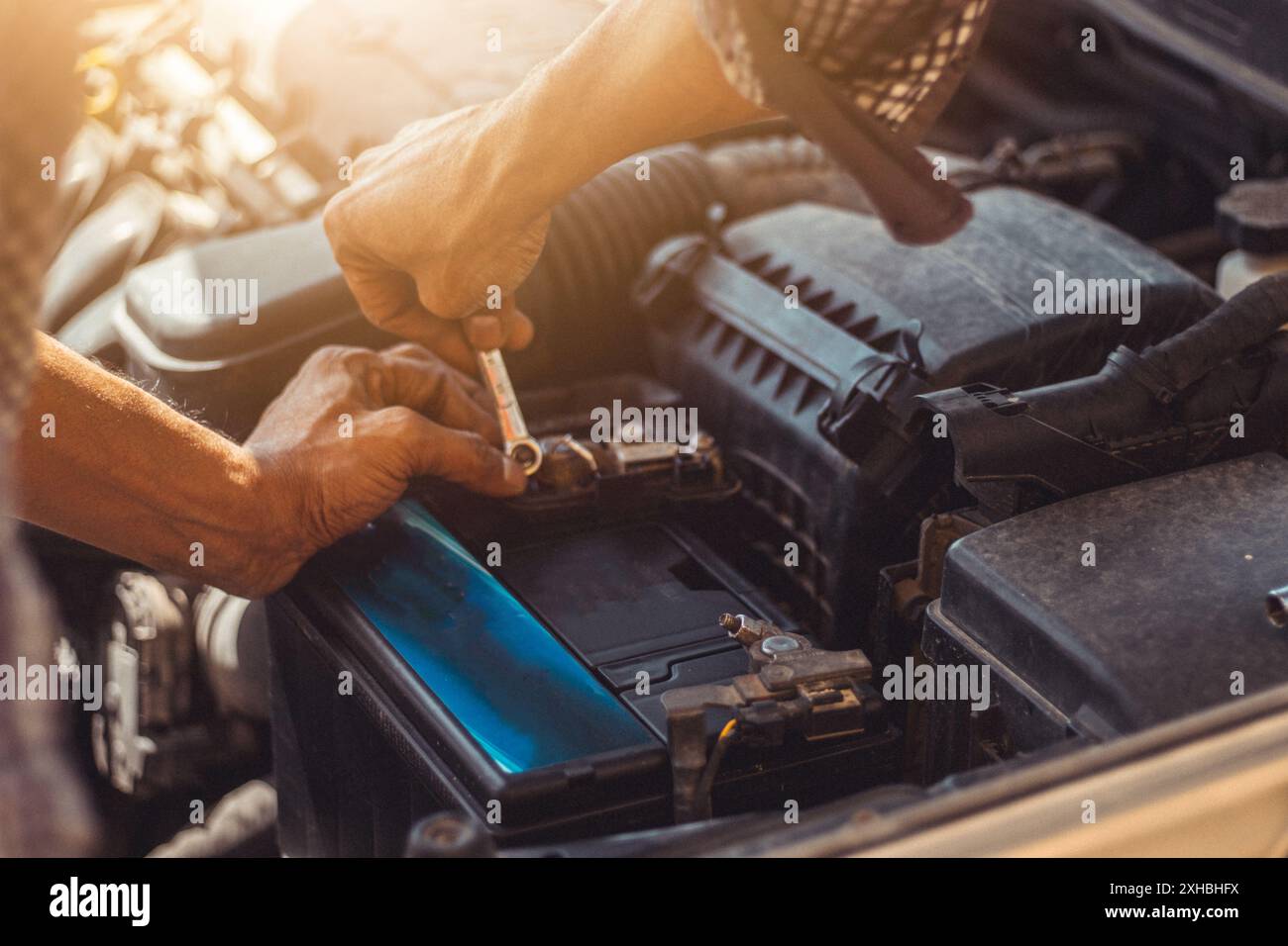 opened the car's bonnet, revealing the battery and engine. An ...