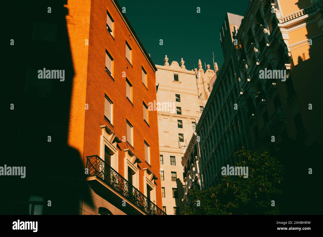 Facades of orange, beige buildings in different architectural styles ...