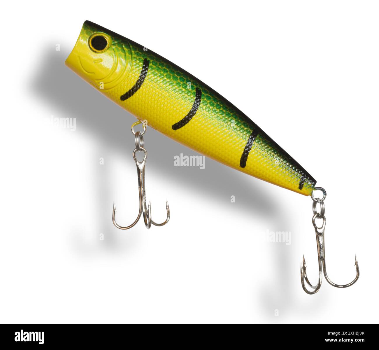 Shadow behind an artificial fishing bait used on the water surface with ...