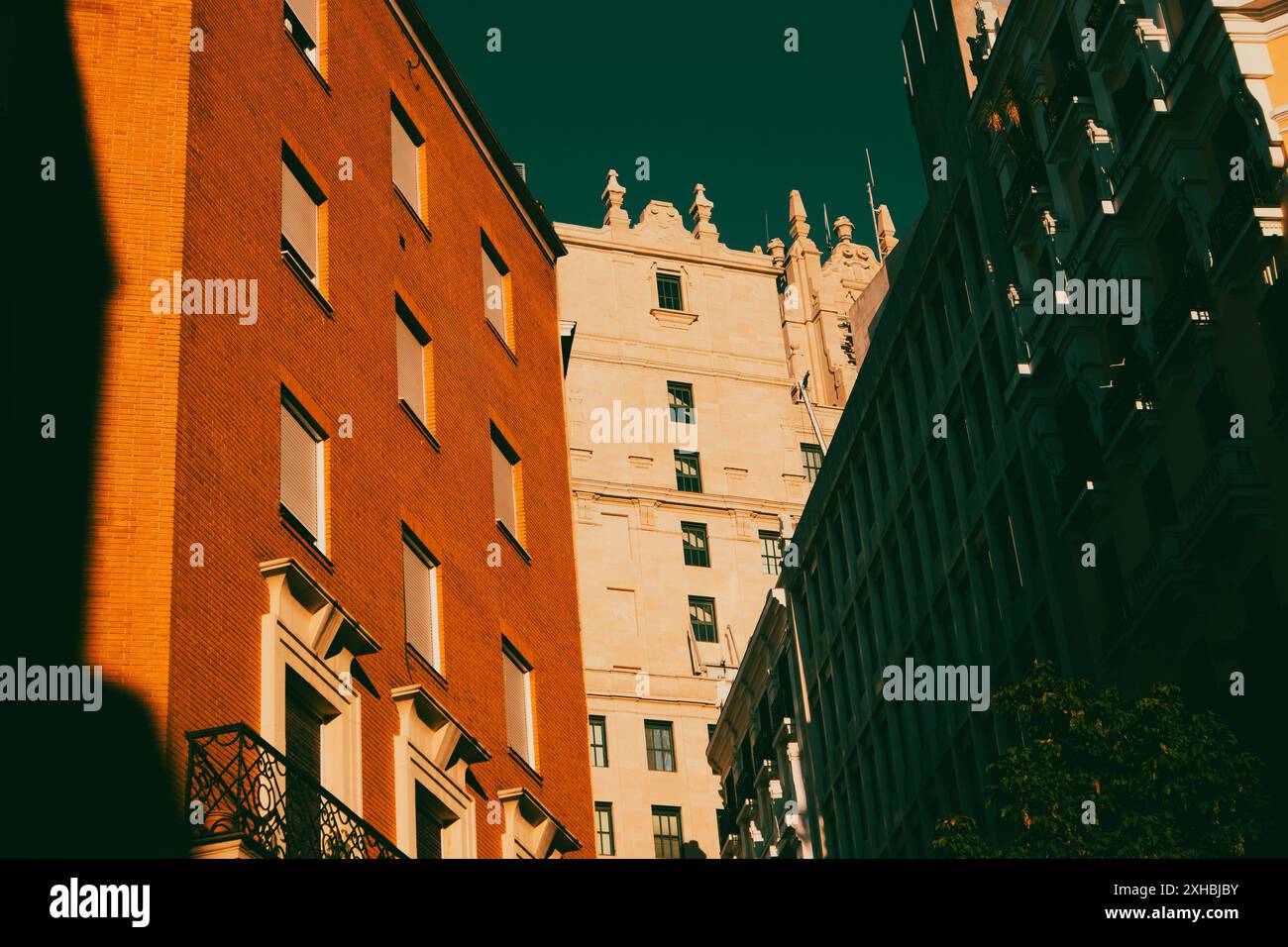 Facades of orange, beige buildings in different architectural styles ...