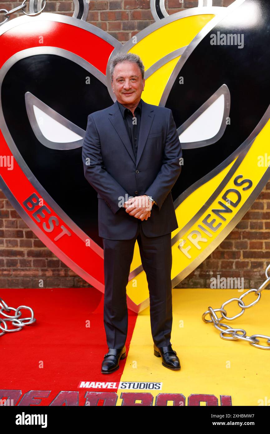Louis D'esposito poses for photographers upon arrival at the screening ...