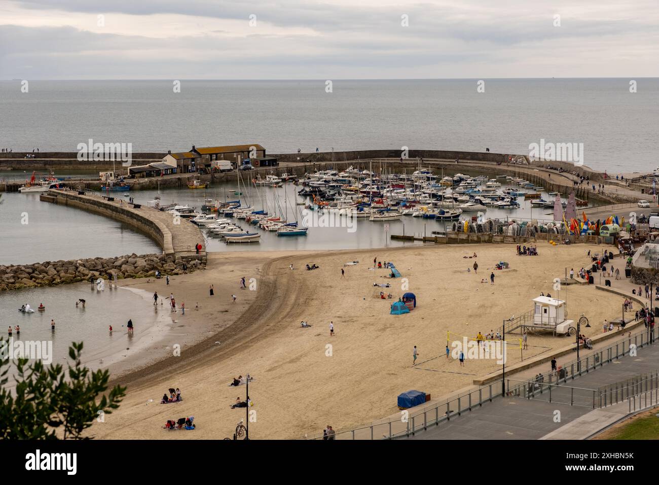 High up view over the beach and harbour in the seaside town of Lyme ...