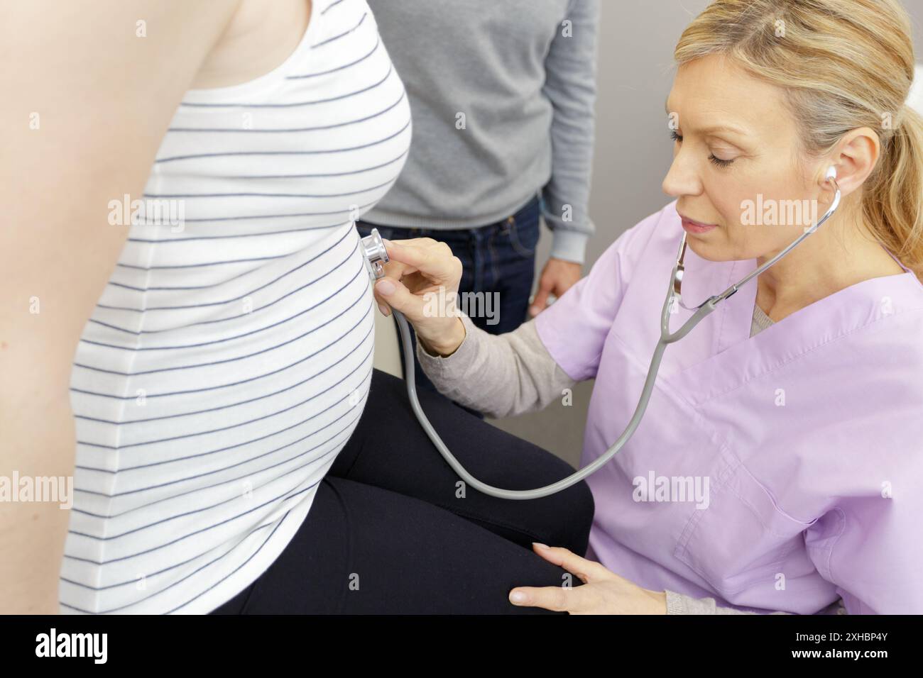 doctor using stethoscope white examining pregnant woman Stock Photo - Alamy
