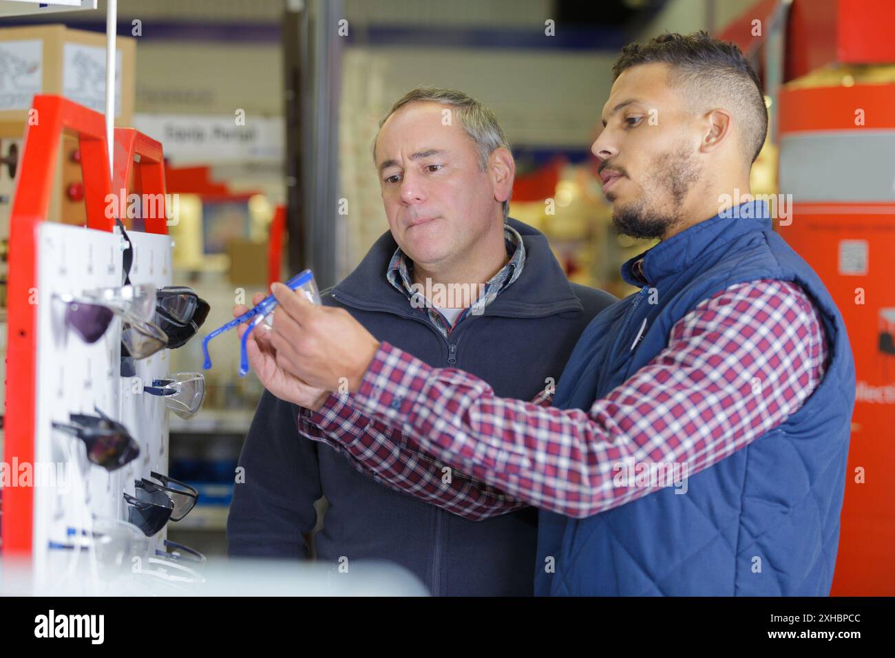 construction workers choosing glasses Stock Photo - Alamy